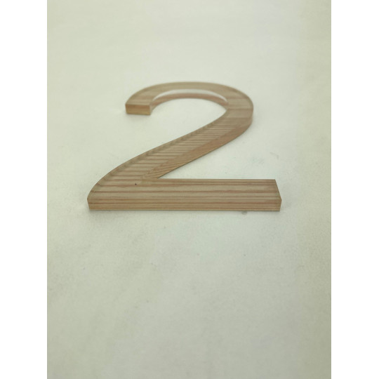 Réalisation Lettrage découpé en plexi avec un vinyle décor Bois